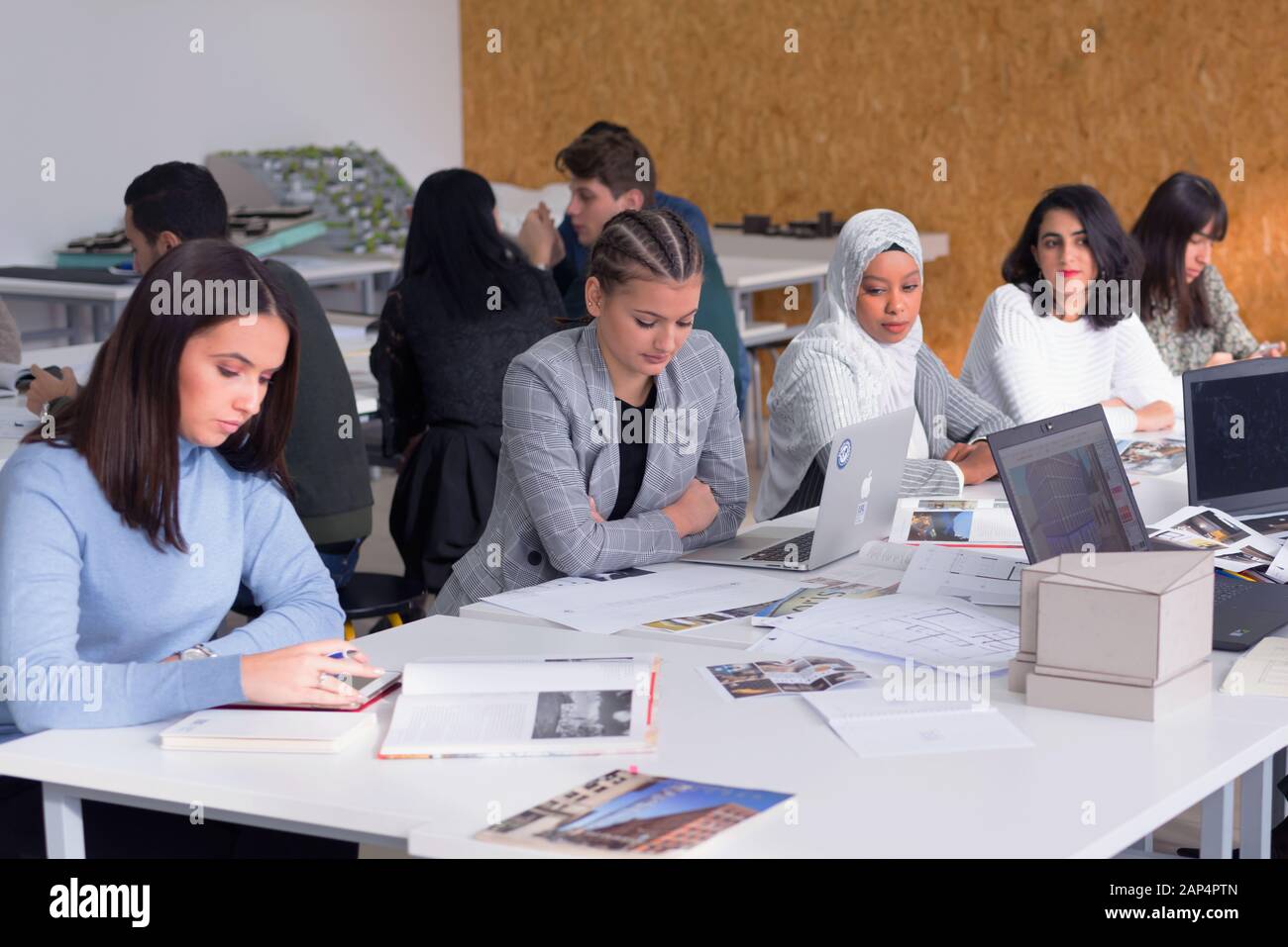 Group of university architecture students working on practice lessons ...