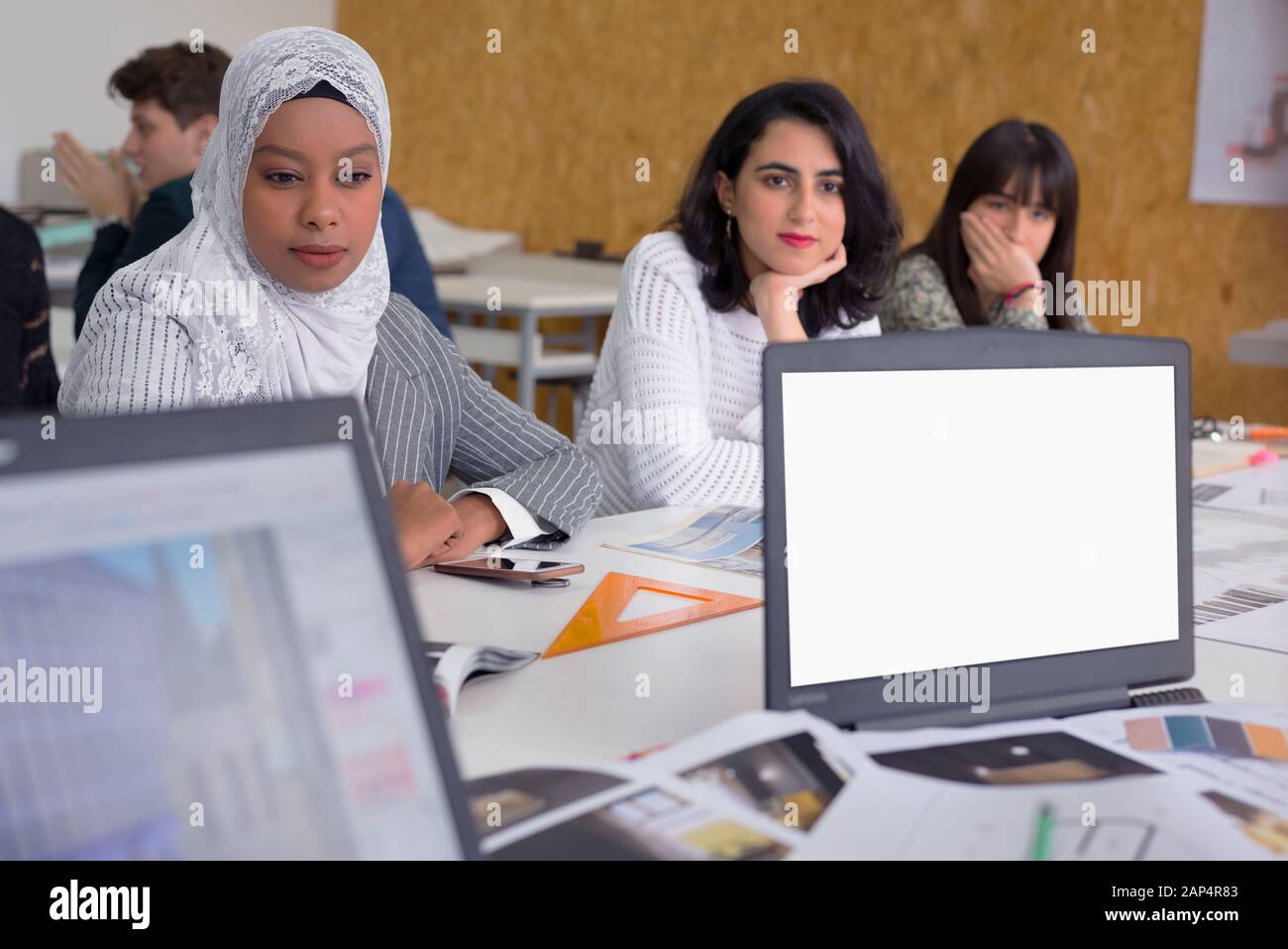 Group of university architecture students working on practice lessons ...