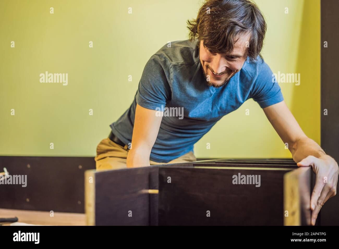 Frustrated Man Putting Together Self Assembly Furniture Stock Photo - Alamy