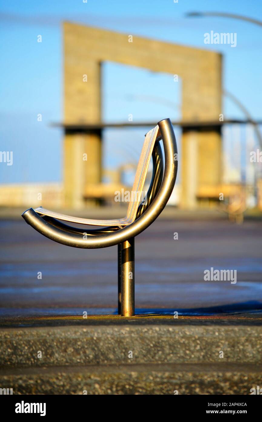 Stylish curved steel seat on Blackpool promenade Stock Photo - Alamy
