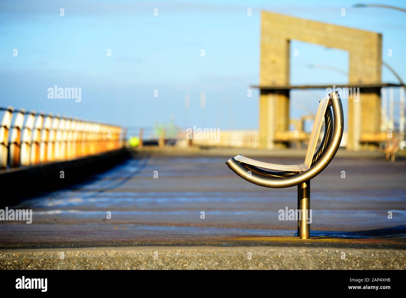 Stylish curved steel seat on Blackpool promenade Stock Photo - Alamy
