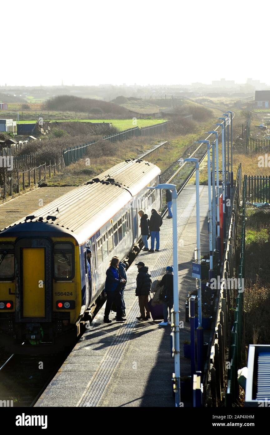 People boarding two carriage train on single track line at Squires Gate ...
