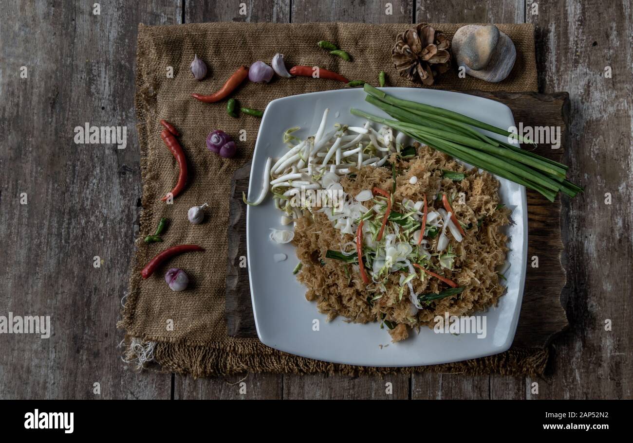 Asian eating food, Mee Grob is an sweet and sour crispy noodles, made ...