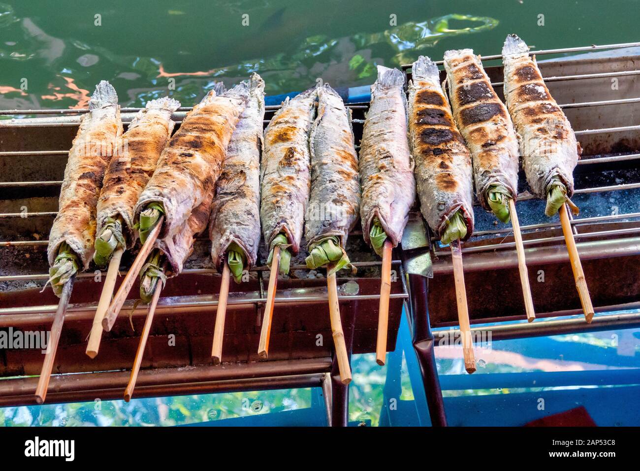 Salted seabass (Pla Pao) on sale in the Talin Chan floating market ...