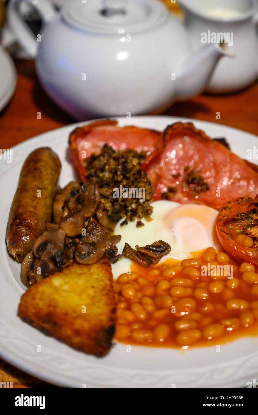 White board with full Scottish breakfast with bacon, fried egg, beans ...