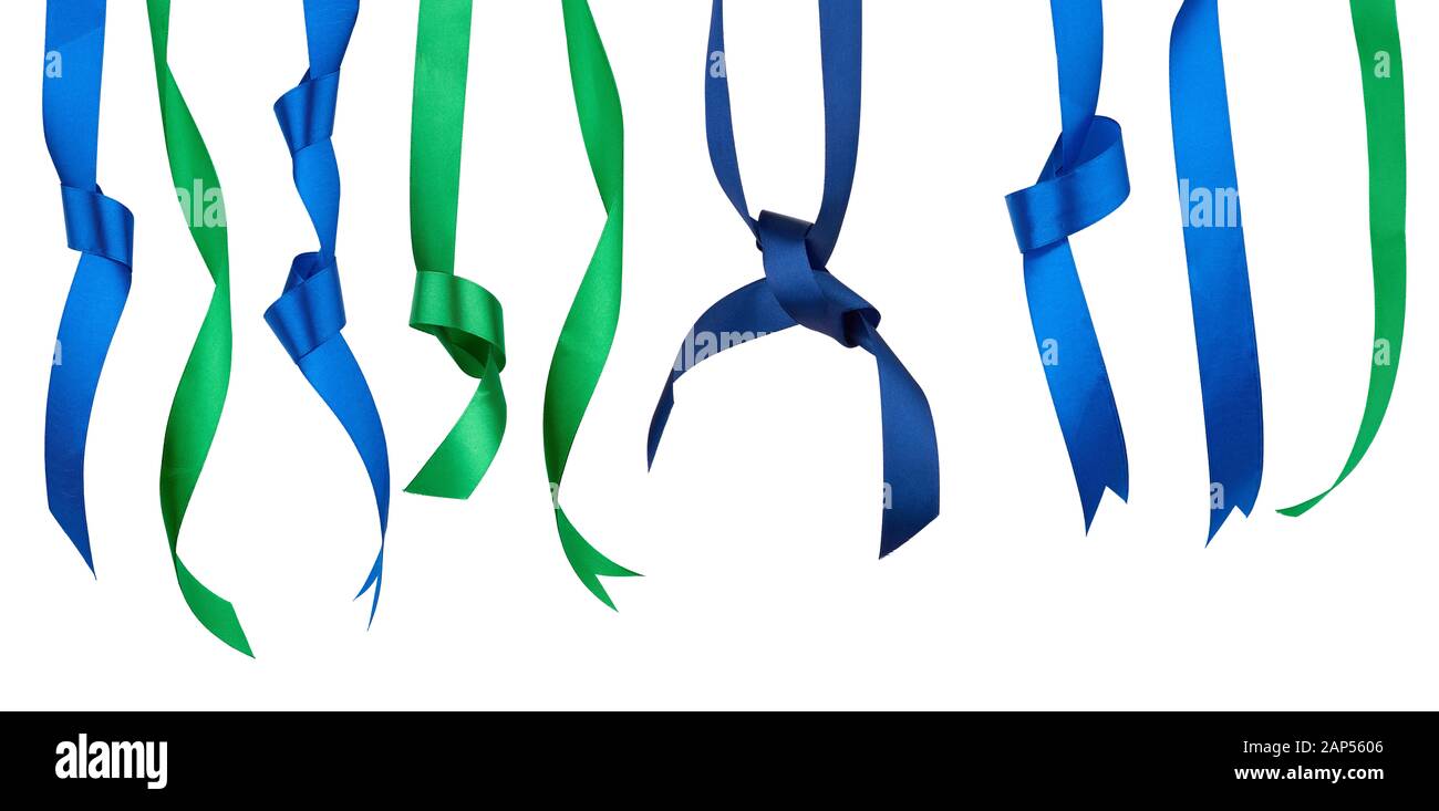set of twisted blue silk ribbon ends with knots isolated on white ...