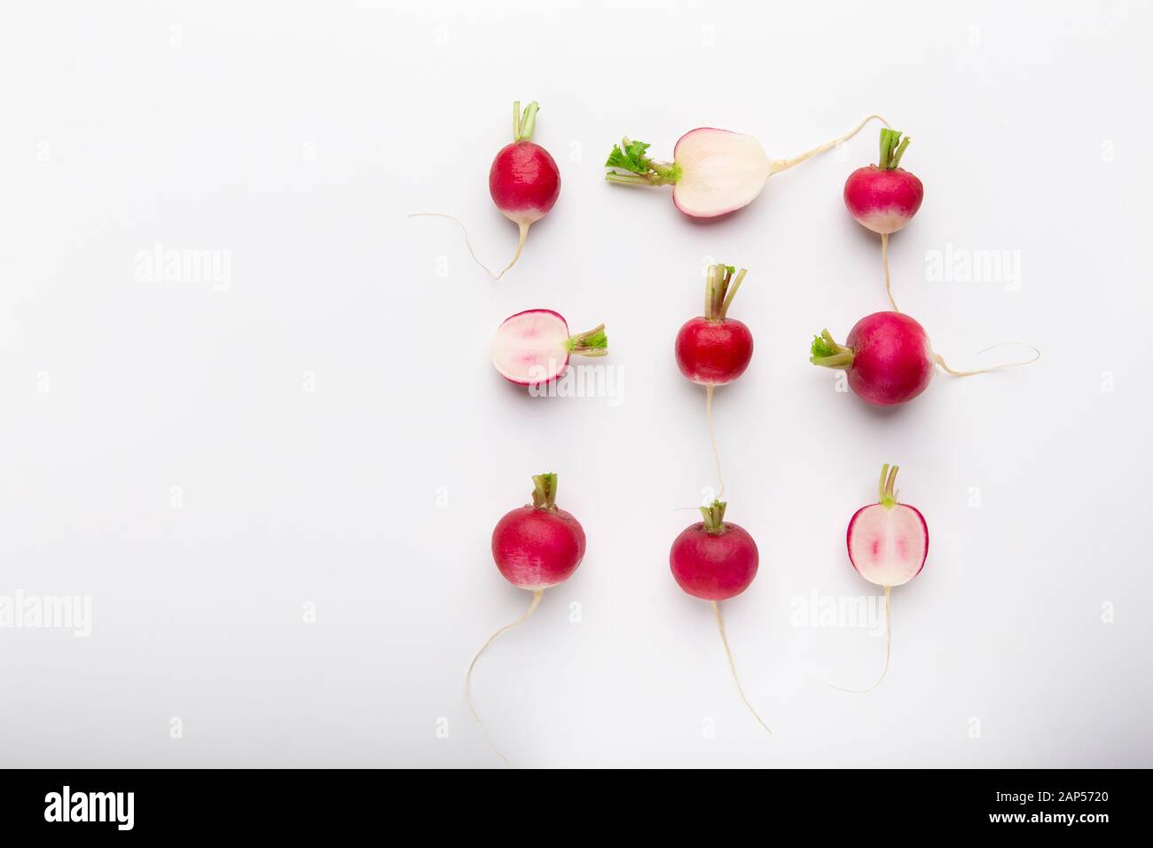 Composition of cut and whole radishes on white background Stock Photo ...