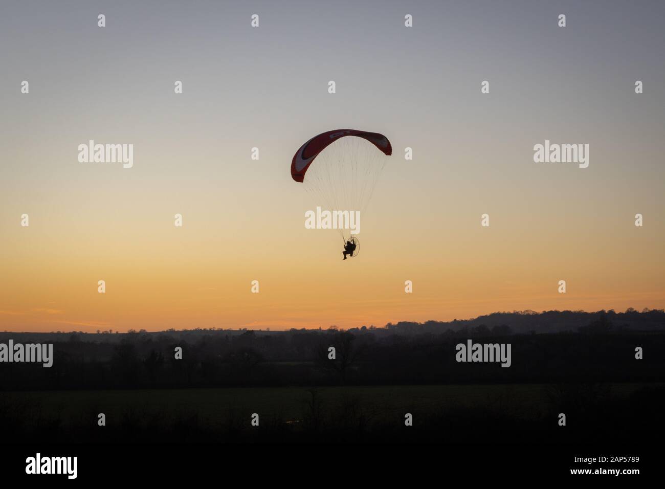 Paraglider over sky in evening hi-res stock photography and images - Alamy
