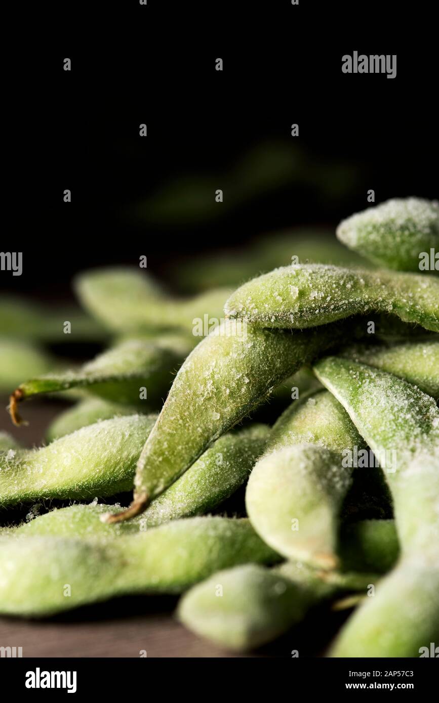 closuep of a pile of frozen edamame, japanese green soybeans in the pod ...