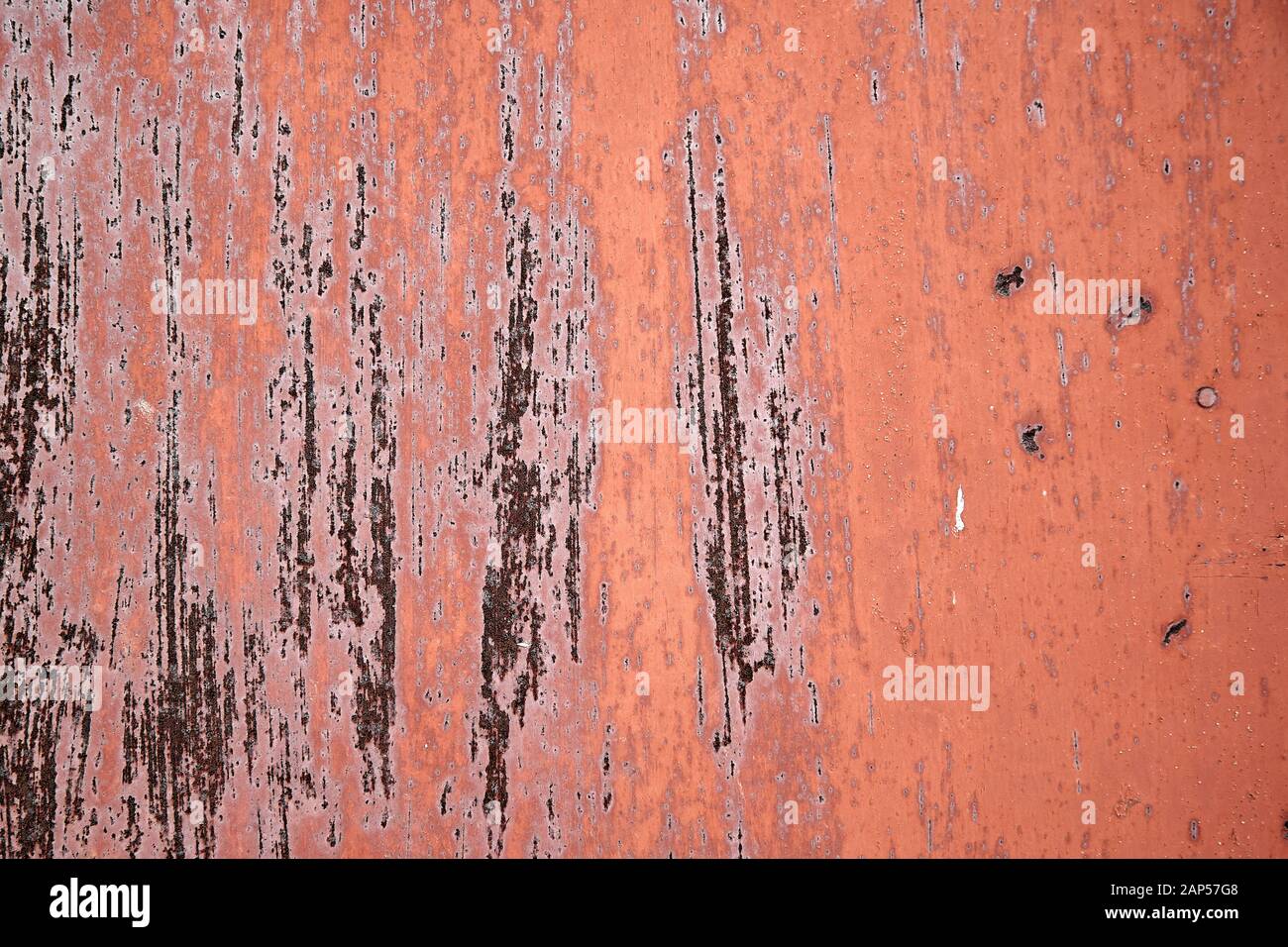 Rusty metal surface with peeled paint and etched numbers. Abstract ...