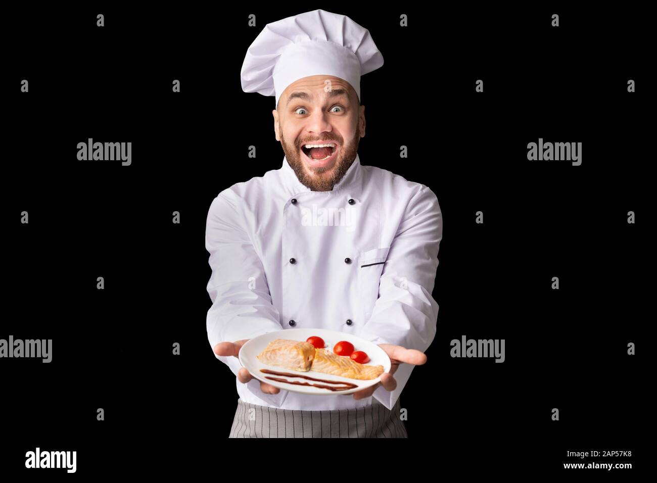 Excited Chef Showing Plate Serving Fish Dish Posing, Studio Shot Stock ...