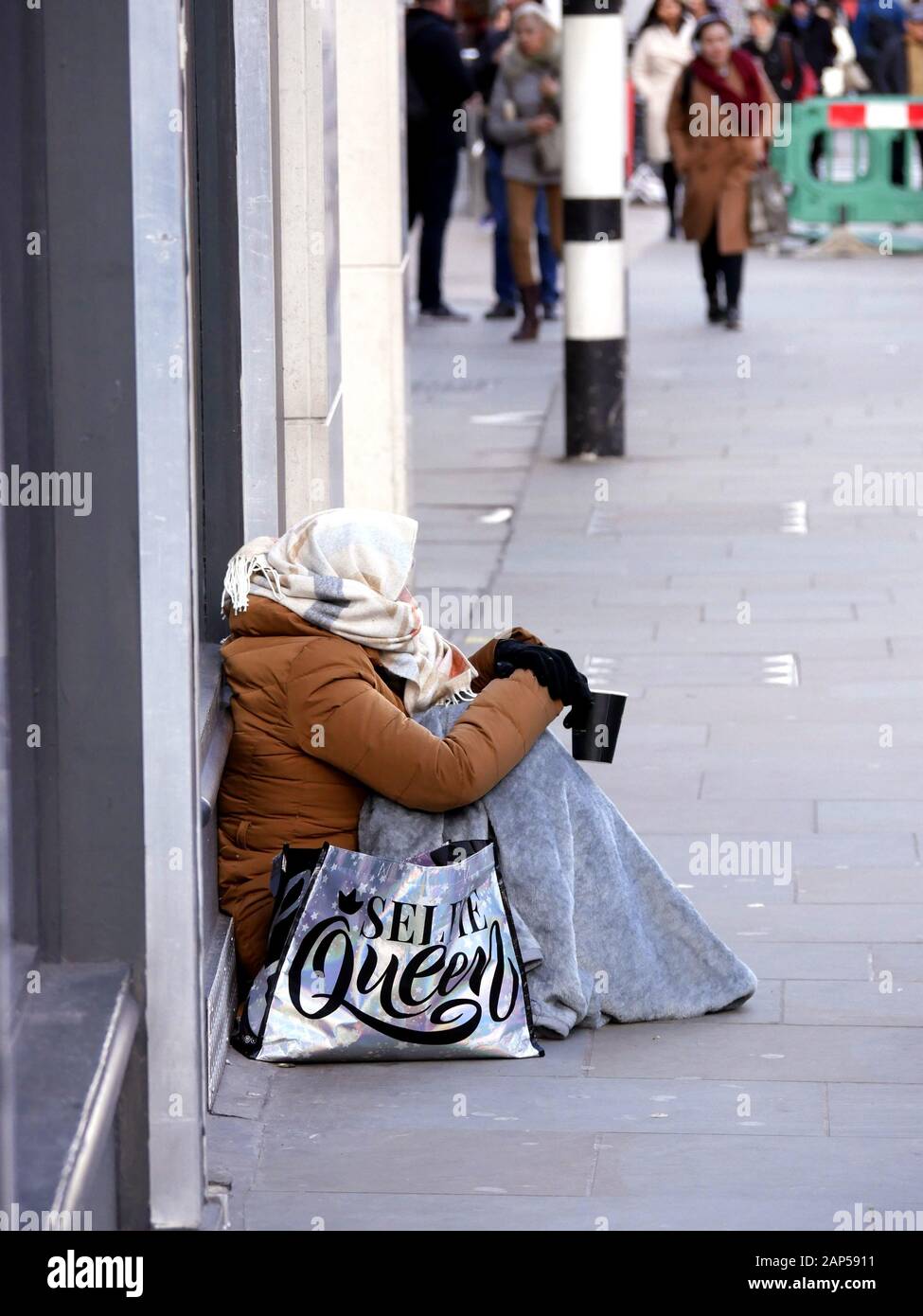 Begging cup hi-res stock photography and images - Alamy
