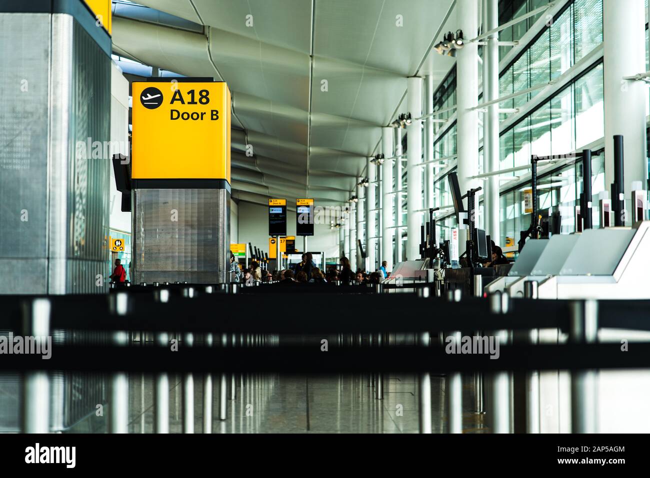 London, Heathrow Airport, Aug 2019: Yellow illuminated signs at airport ...
