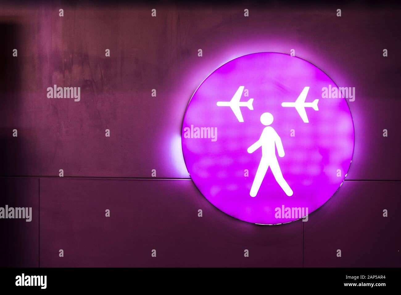 Purple sign with neon light at an international airport. Flight ...