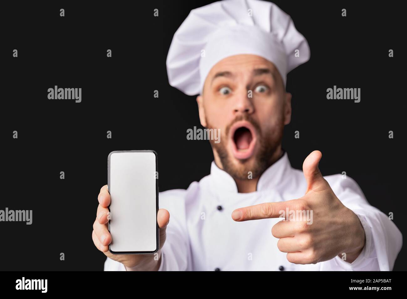 Chef Showing Phone Screen Recommending Application On Black Background ...