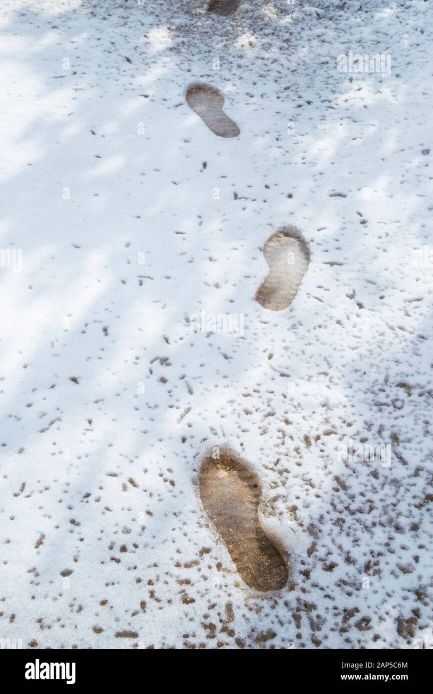 Footprints on the snow Stock Photo - Alamy