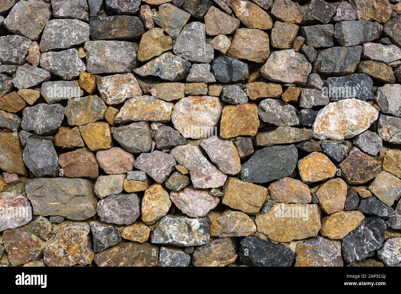 Pattern of rough cut stone wall, Background Stock Photo - Alamy