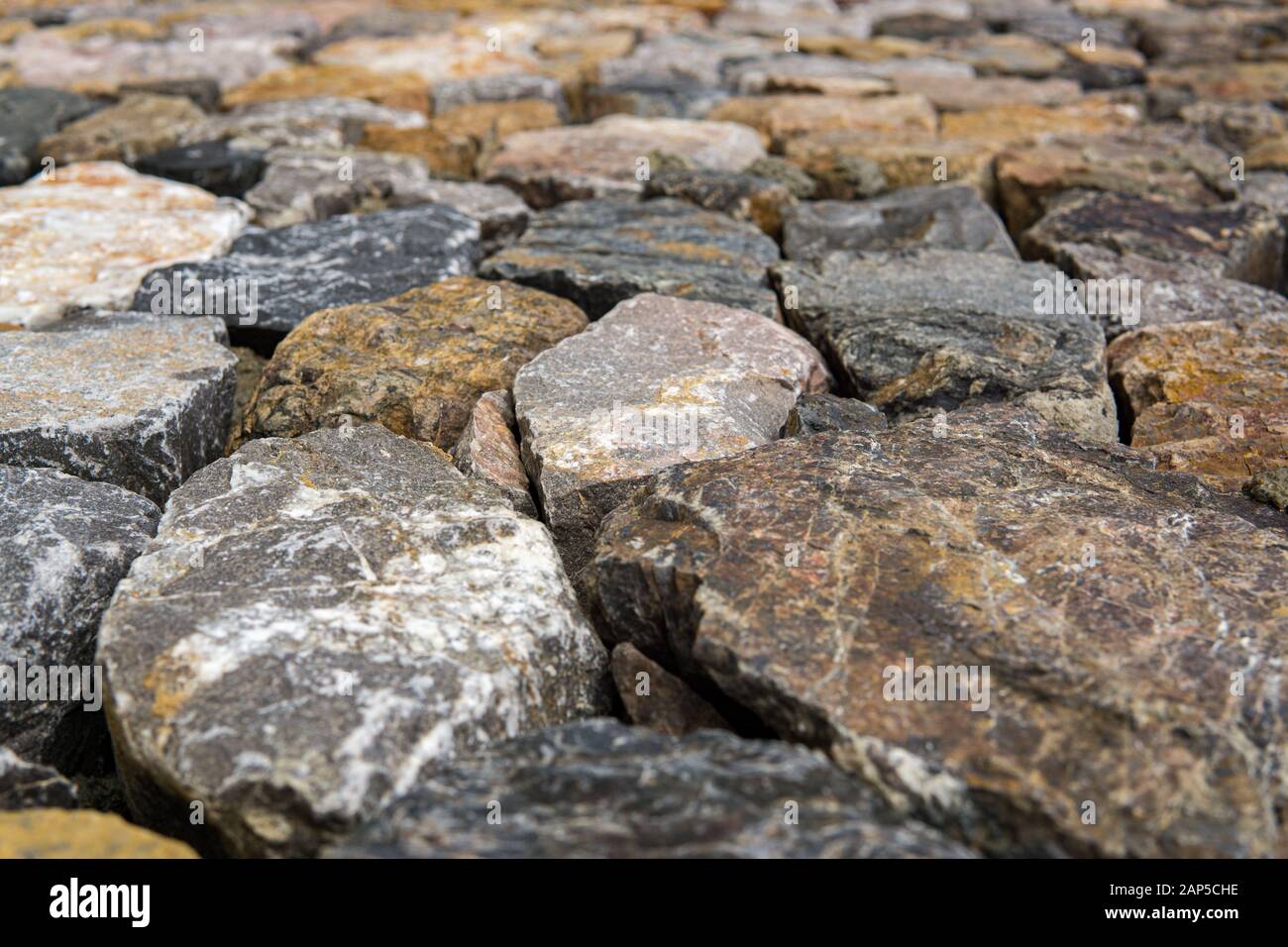 Close up of rough cut stone wall, Background Stock Photo - Alamy
