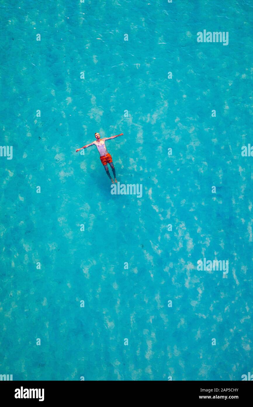 Person Floating In Ocean