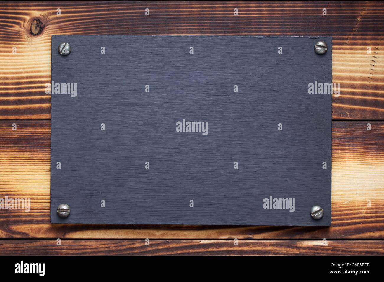 nameplate at wooden background texture surface, with screws Stock Photo ...