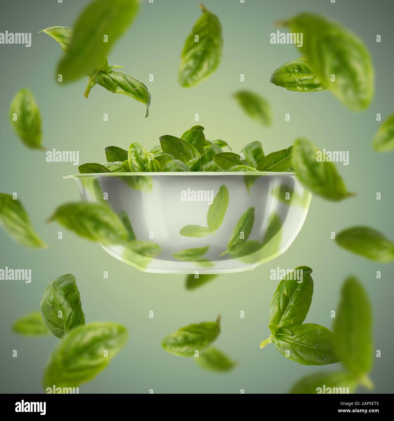 Flying spinach leaves over salad plate, green Stock Photo - Alamy
