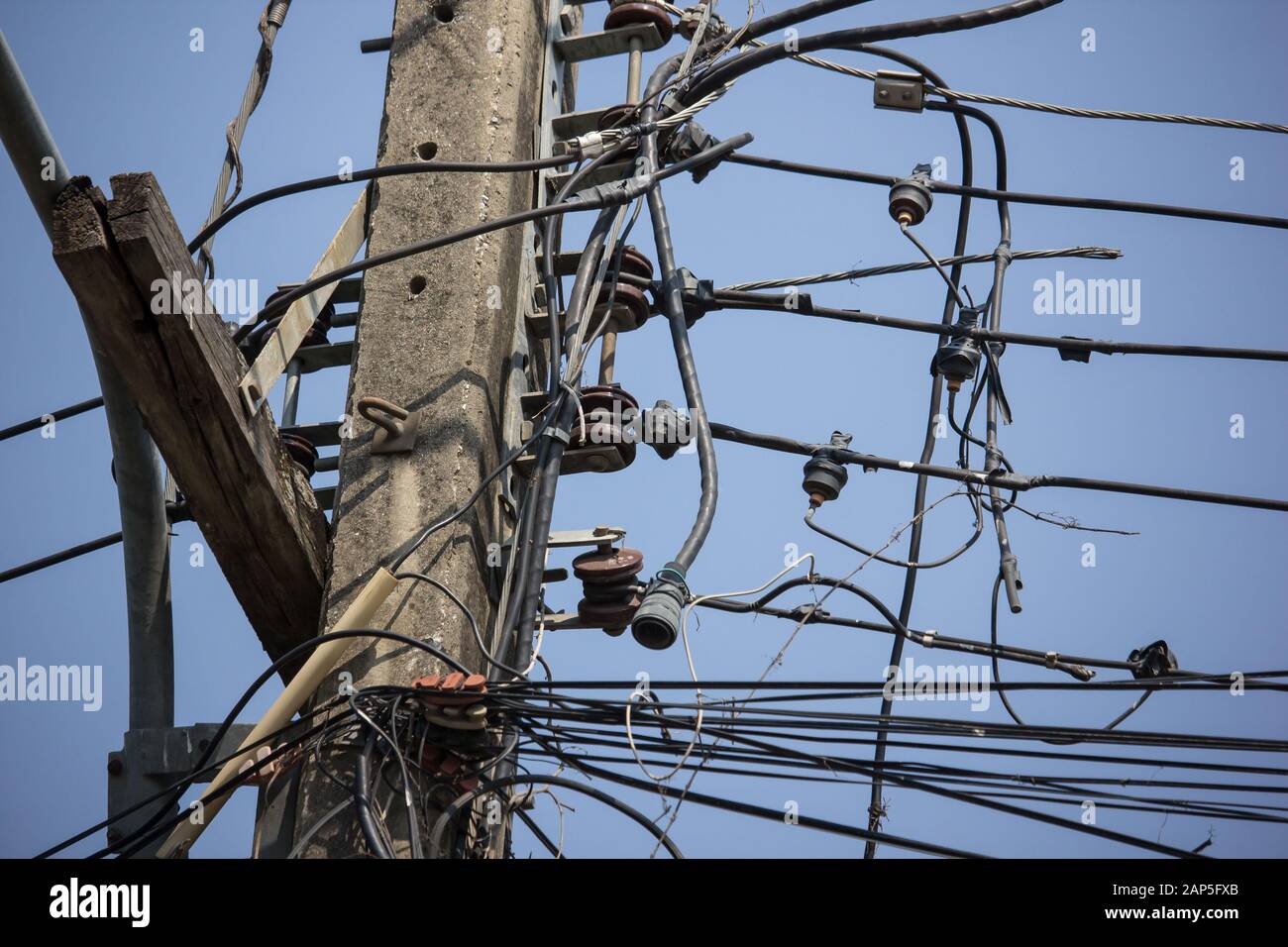 Messy electric wire and cable line Stock Photo - Alamy