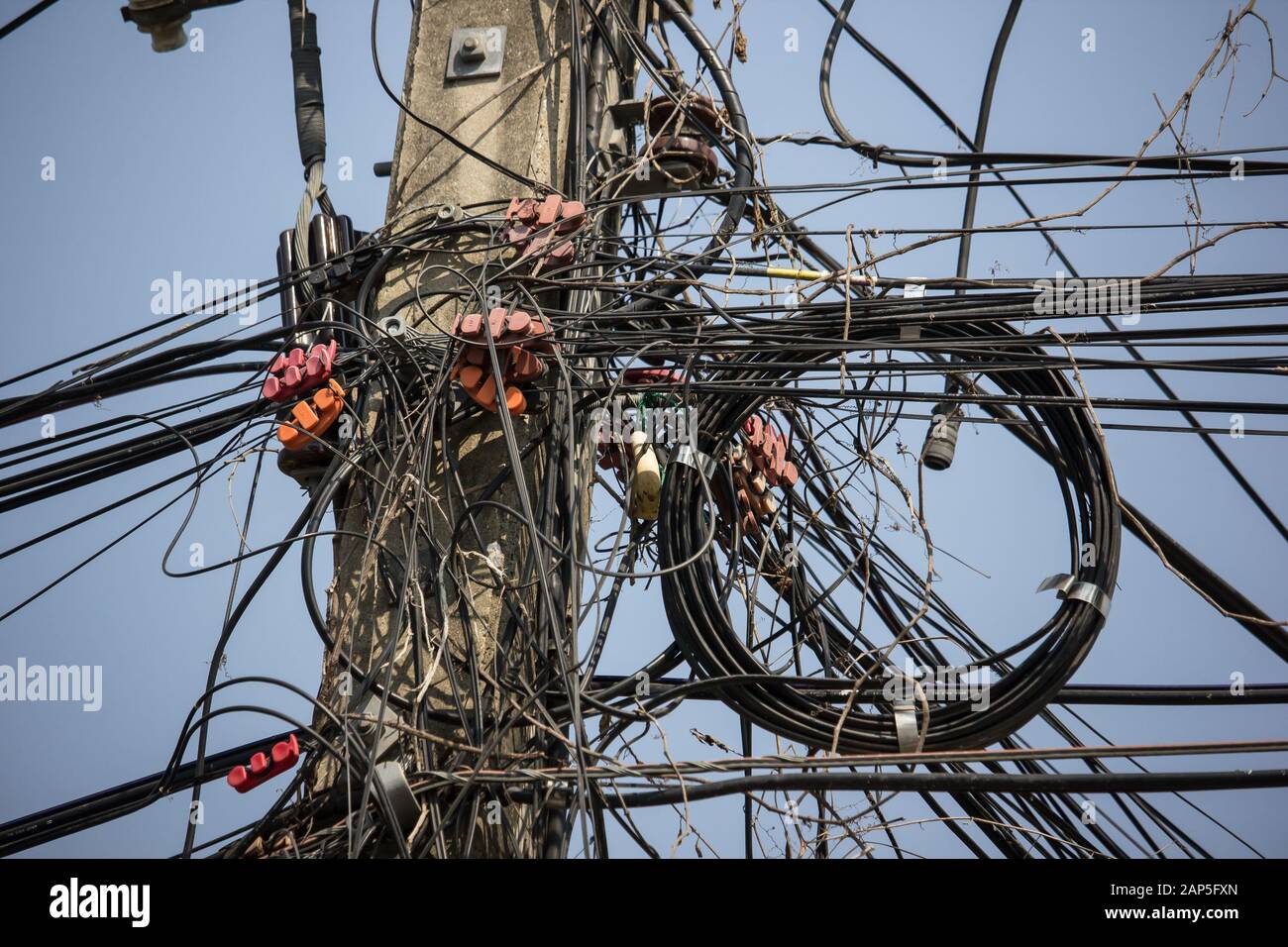 Messy electric wire and cable line Stock Photo - Alamy