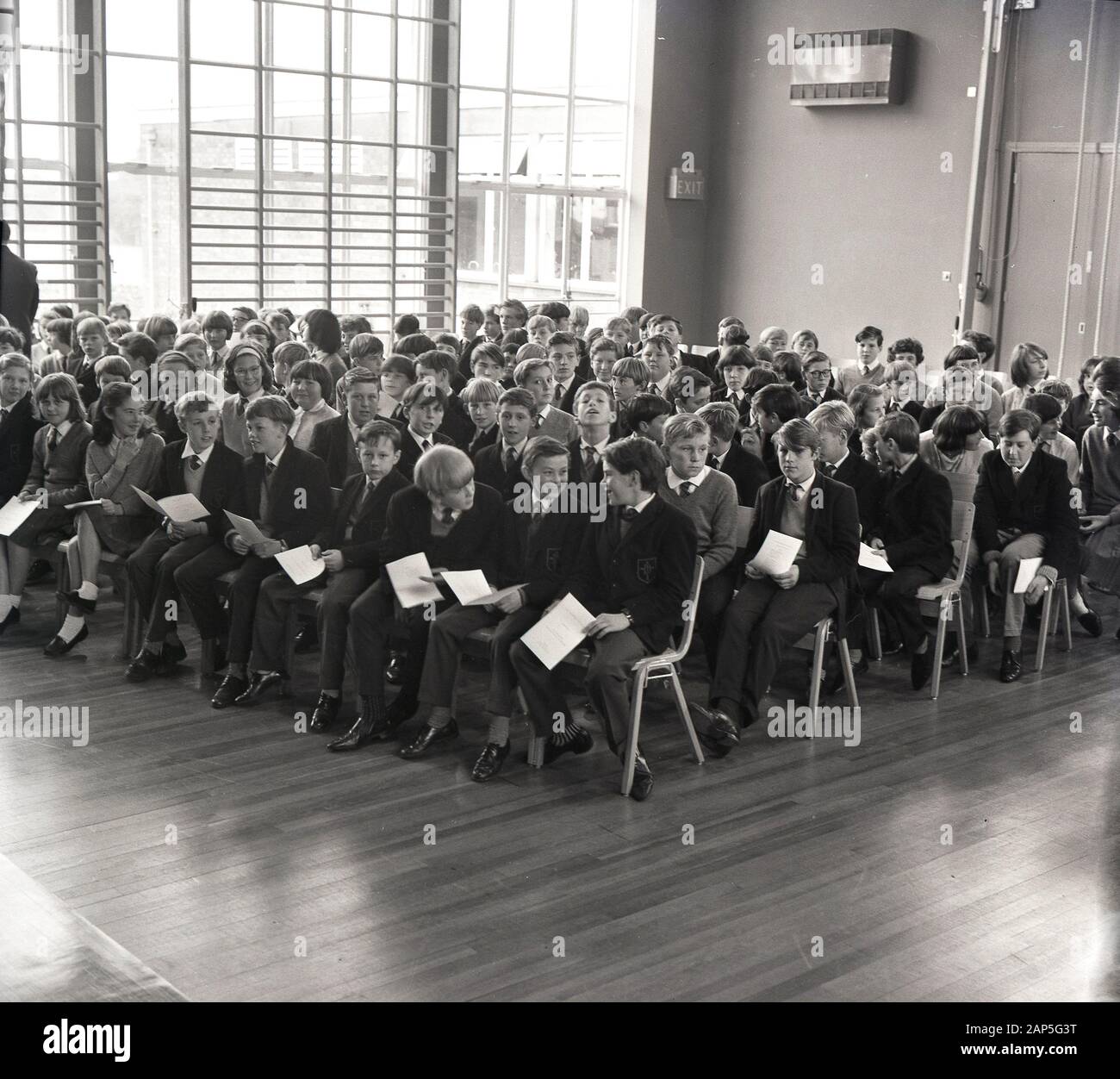 1965, historical, secondary school children sitting together in a ...