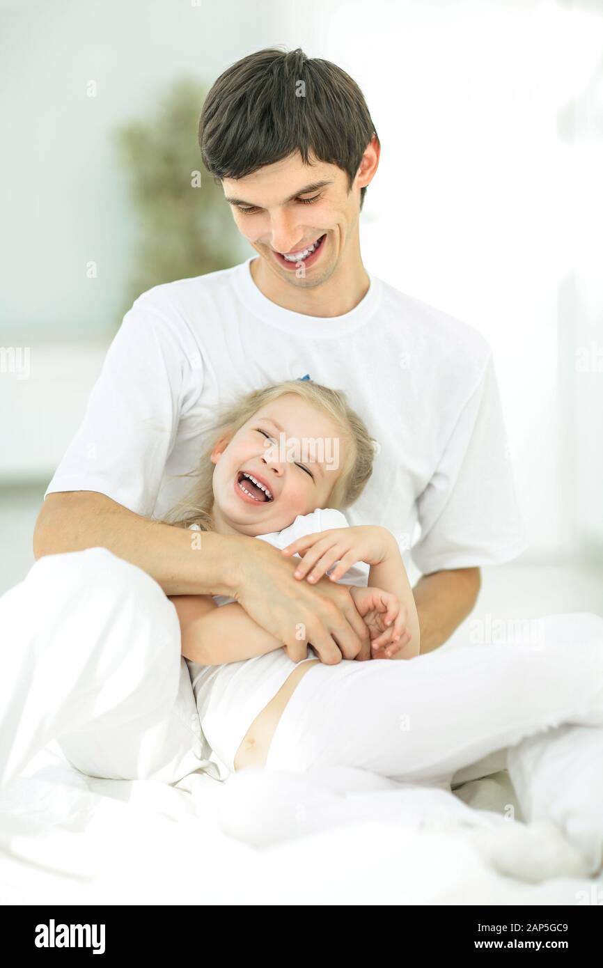 Handsome father and his cute little daughter are playing Stock Photo - Alamy