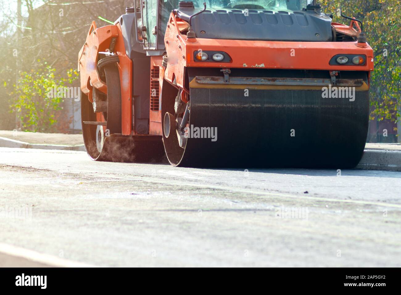 Road rollers building the new asphalt road. wagon, truck, paver machine ...