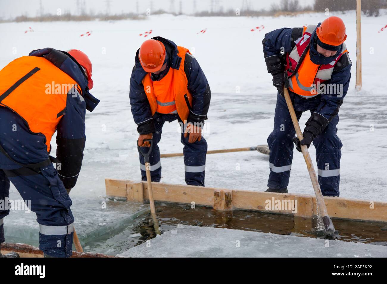 Sailors work at the lane with a fenced wooden formwork Stock Photo - Alamy