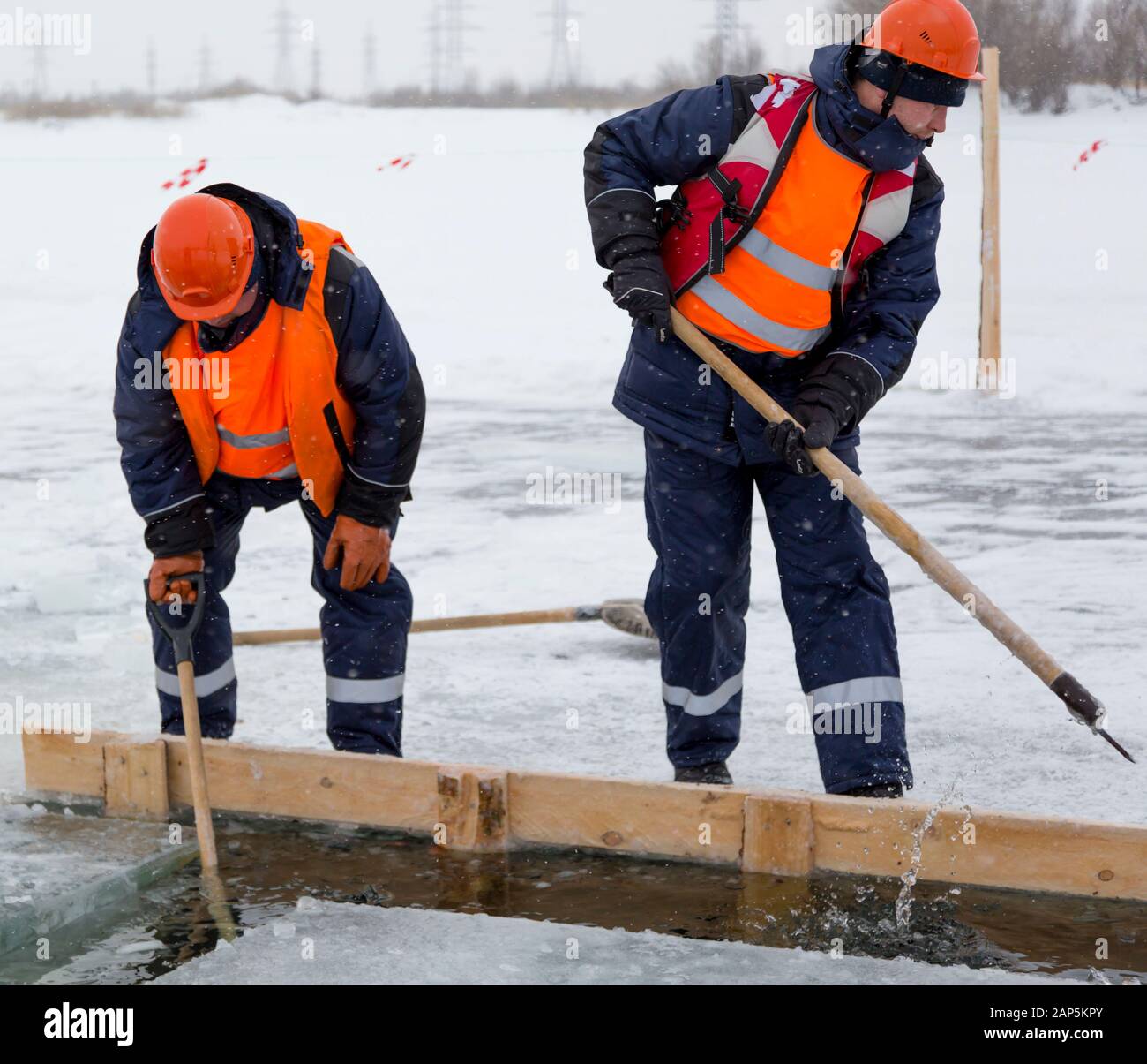 Sailors work at the lane with a fenced wooden formwork Stock Photo - Alamy
