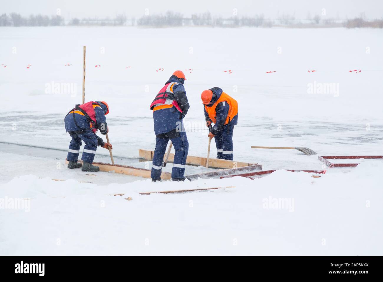 Sailors work at the lane with a fenced wooden formwork Stock Photo - Alamy