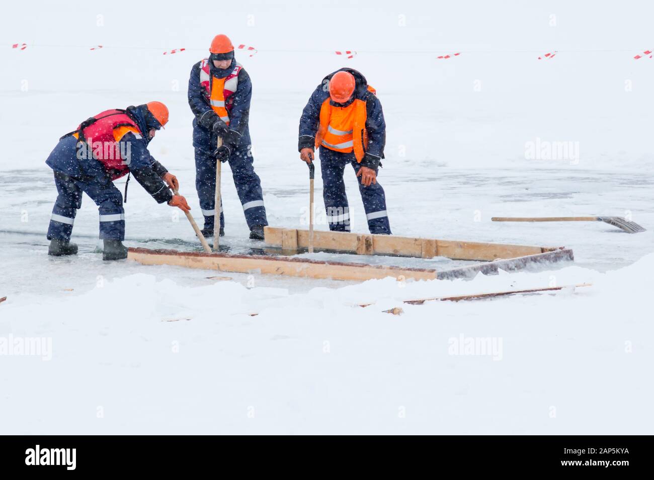 Sailors work at the lane with a fenced wooden formwork Stock Photo - Alamy