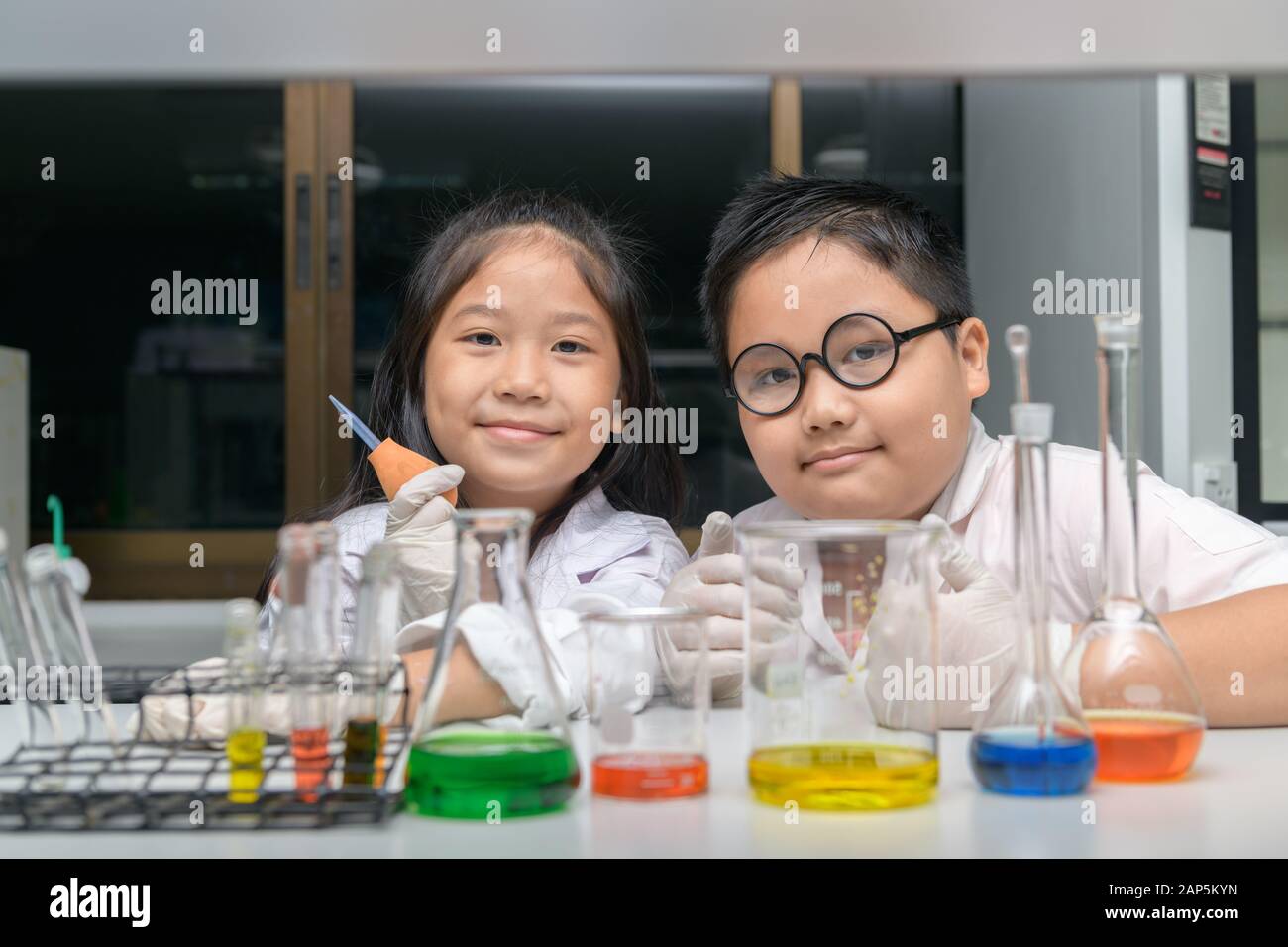 Happy two children making science experiments. Science and Education ...