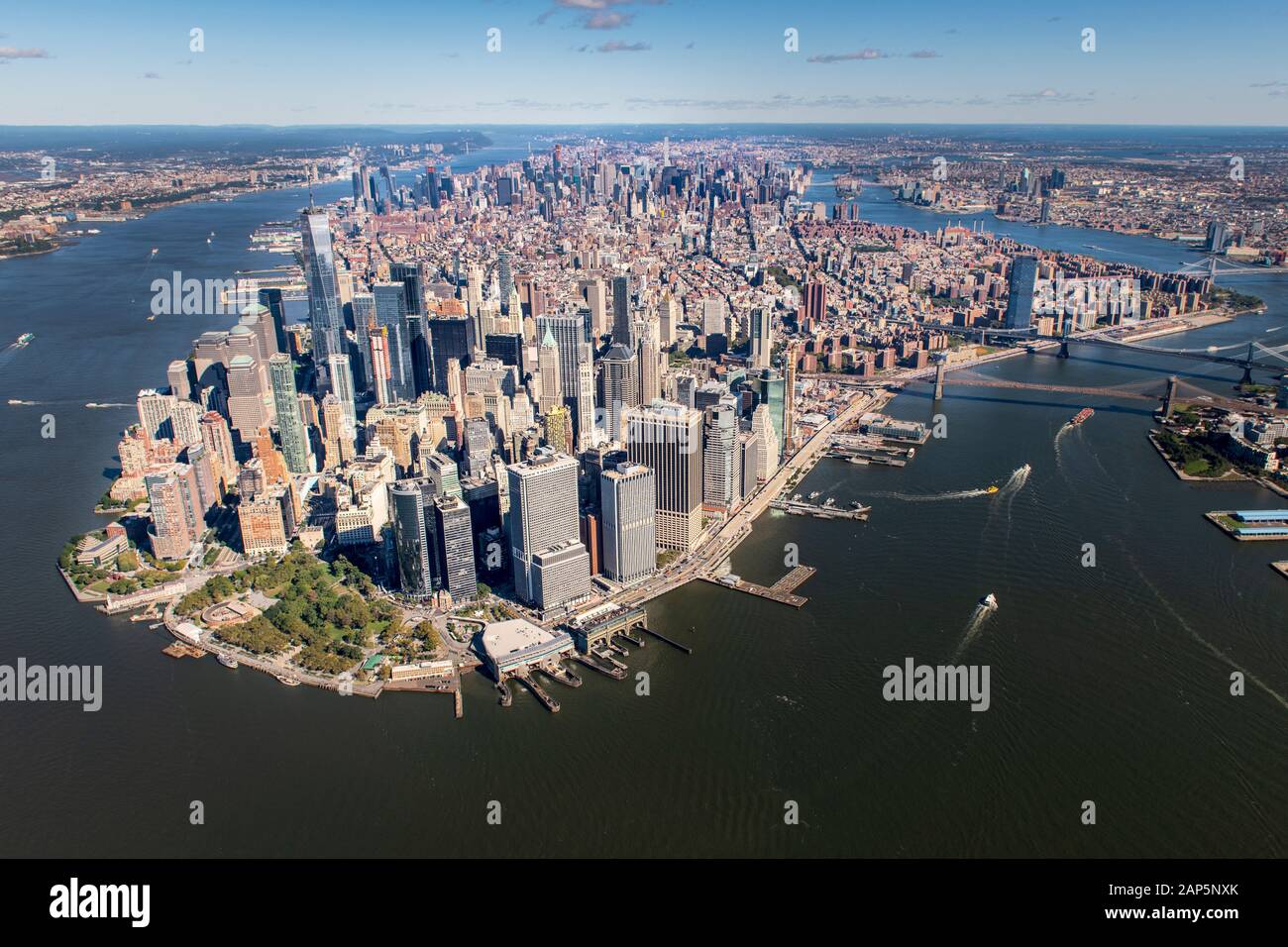 Manhattan skyline from a helicopter above with a blue sky Stock Photo ...
