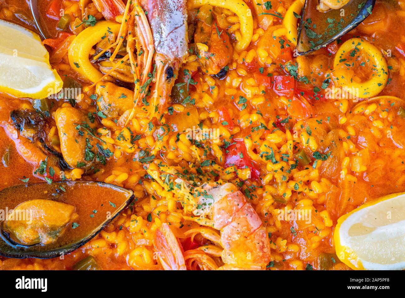 Spanish seafood paella as background Stock Photo - Alamy