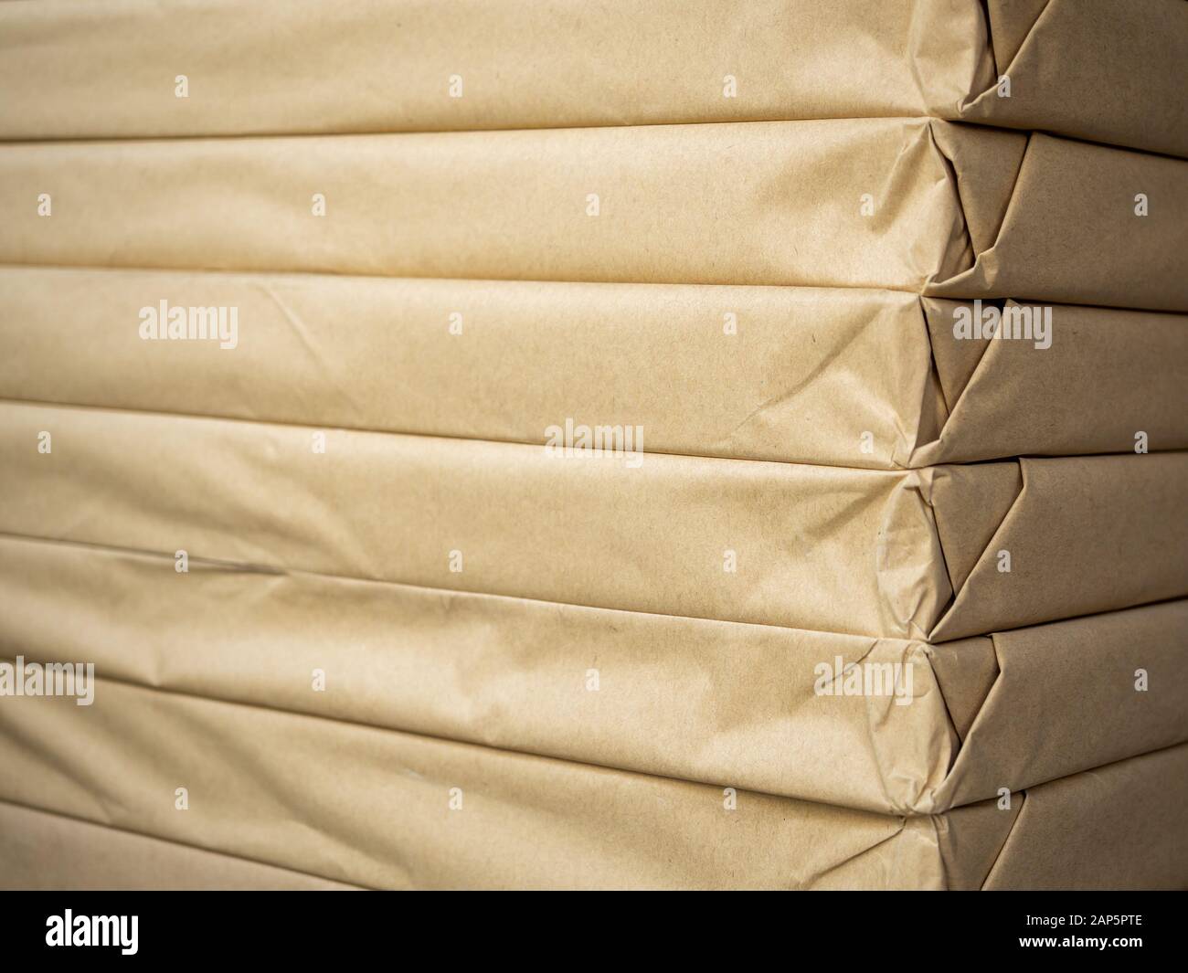 Stack of brown paper packaging. Close-up side of corner of wrapping ...