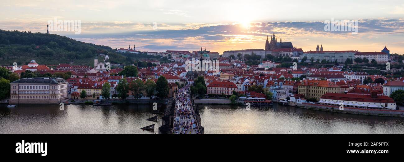 Scenic summer aerial panorama of the Old Town architecture in Prague, Czech Republic. Red roof ...