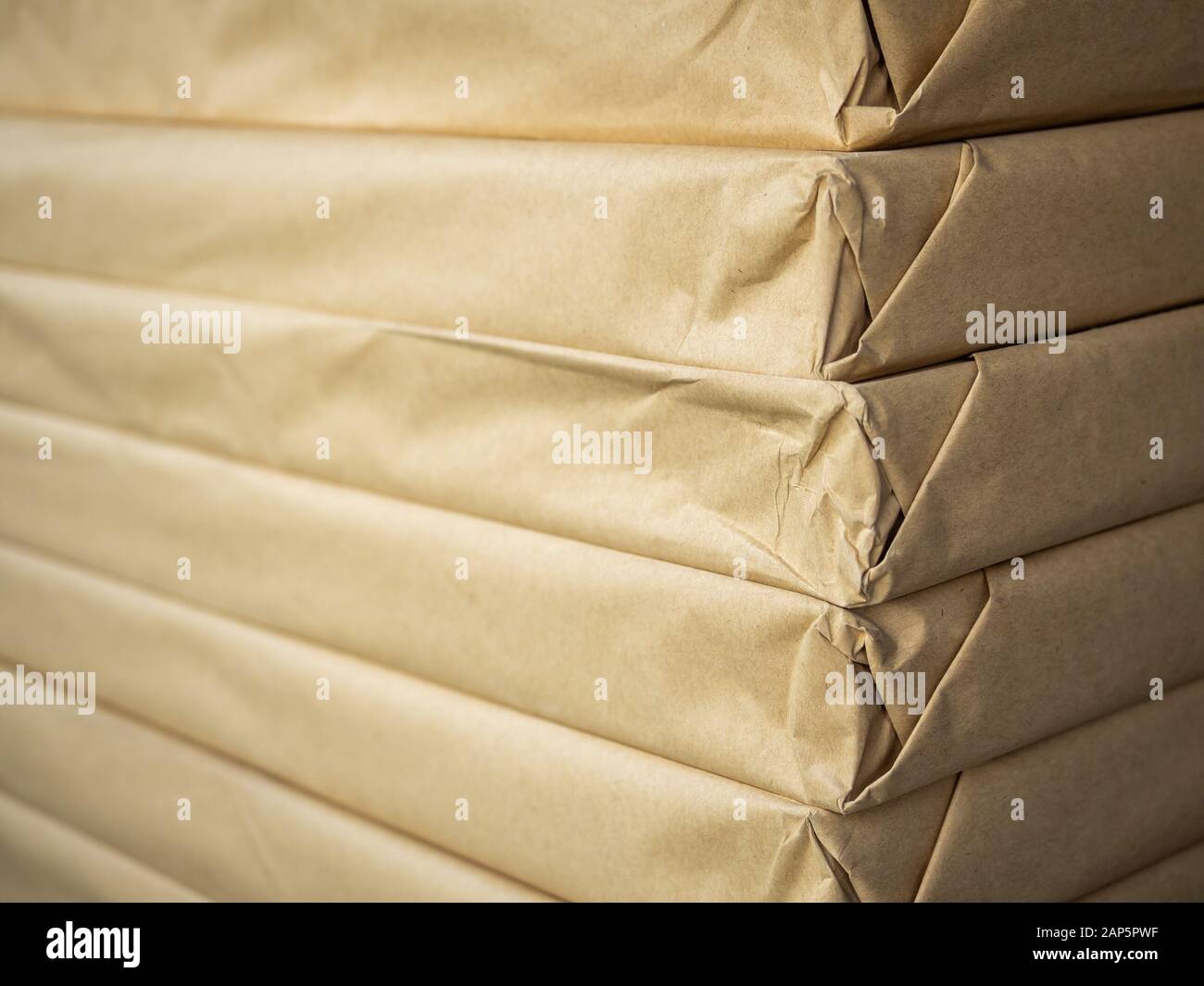 Stack of brown paper packaging. Close-up side of corner of wrapping ...