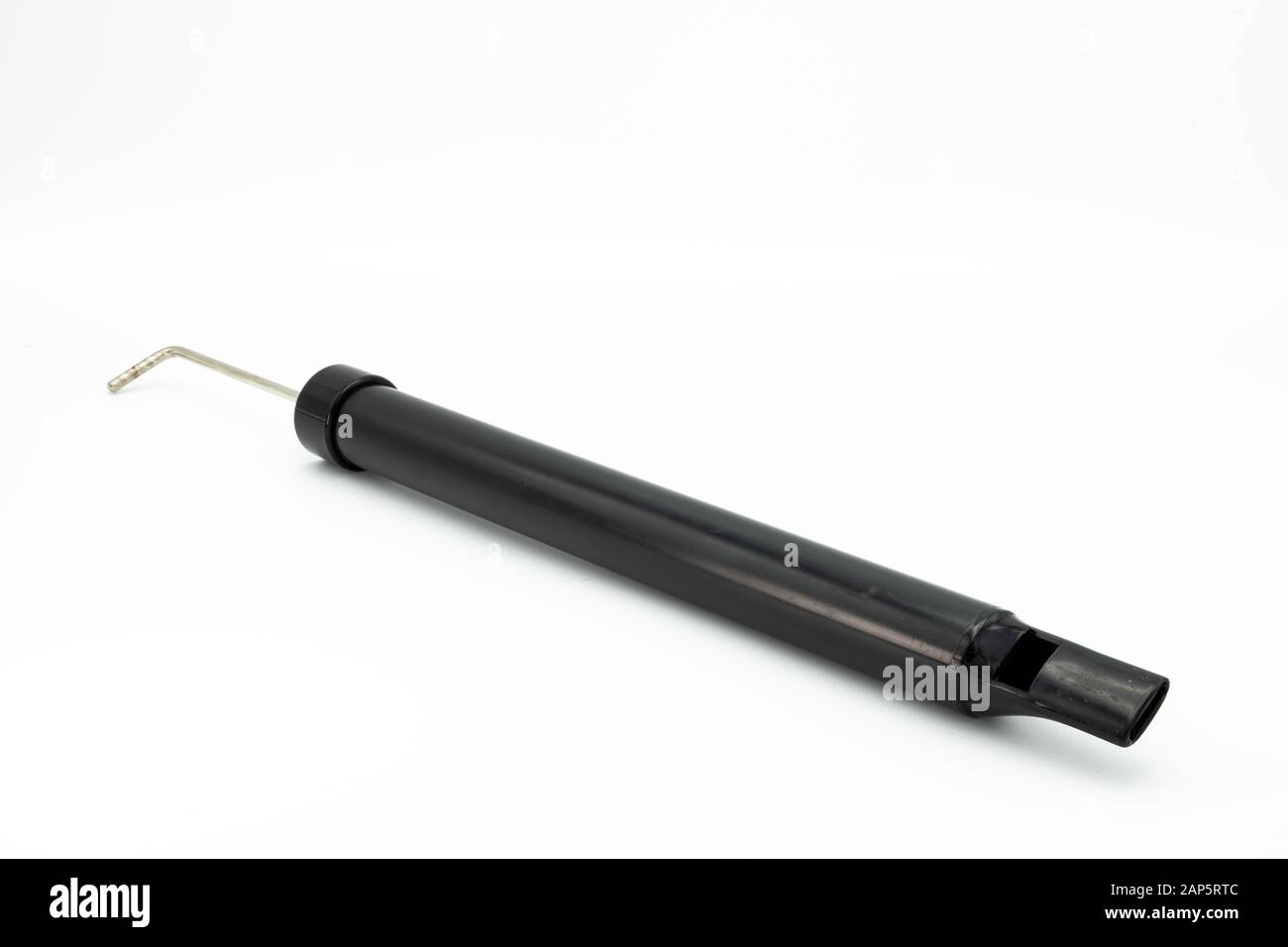 Closeup of a black slide whistle lying on a white background Stock ...