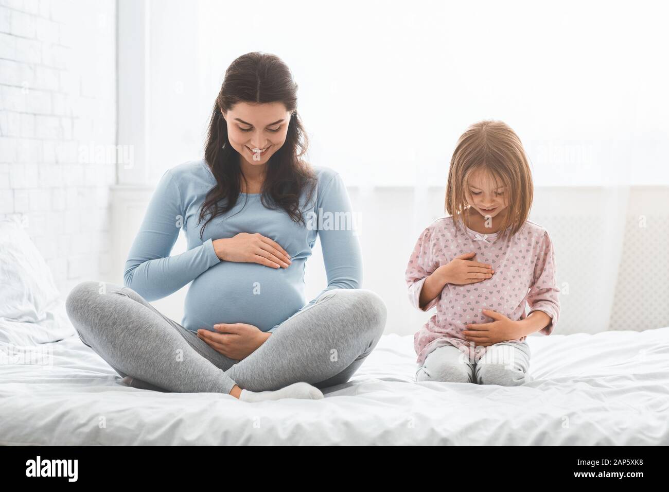 Child imitating parent hi-res stock photography and images - Alamy