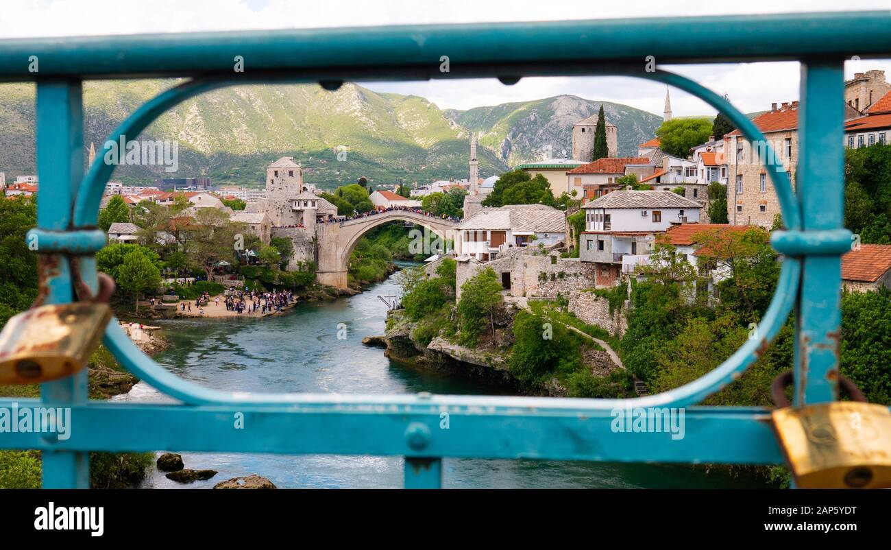 View of the panorama of Mostar through the fence of a Port Bridge over ...