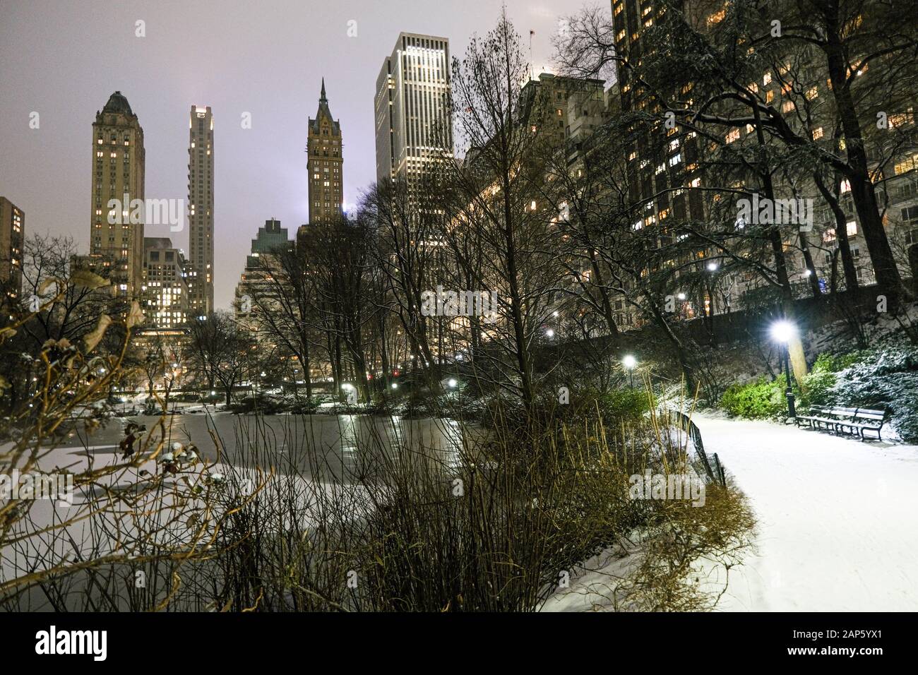 Manhattan skyline and central park in snow at night hi-res stock ...