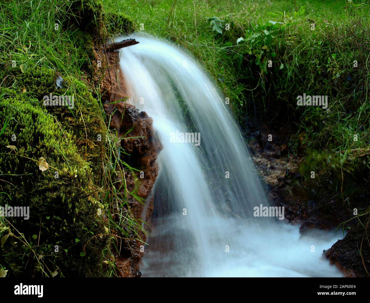 Soft waters running on rocks. Close-up of running water as a picture ...