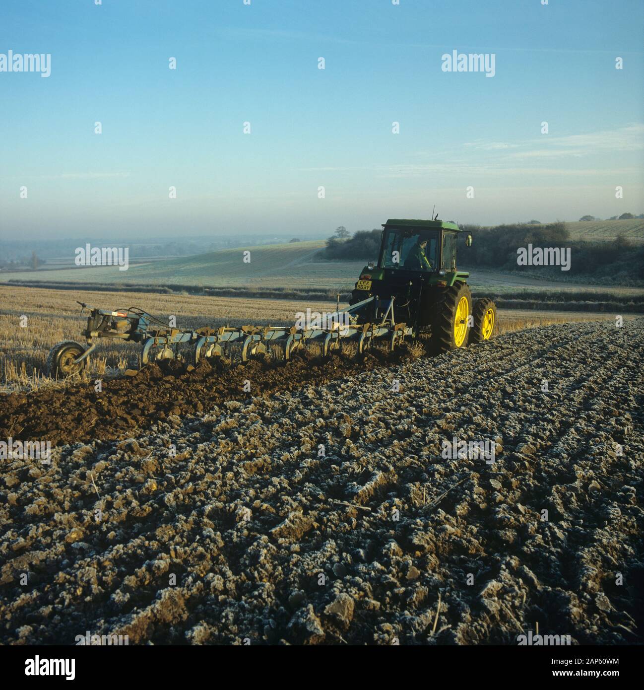 Tractor with a non-reversible, 7 coulter Ransome plough ploughing ...