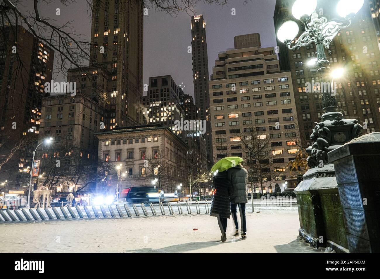 Manhattan skyline and central park in snow at night hi-res stock ...