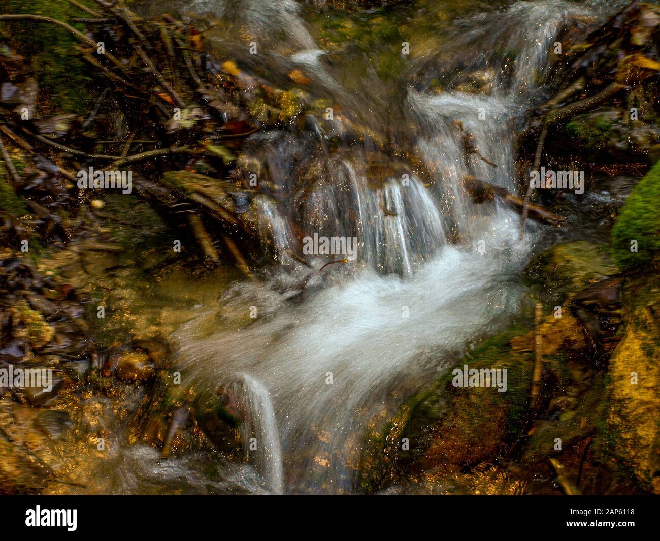 Soft waters running on rocks. Close-up of running water as a picture ...