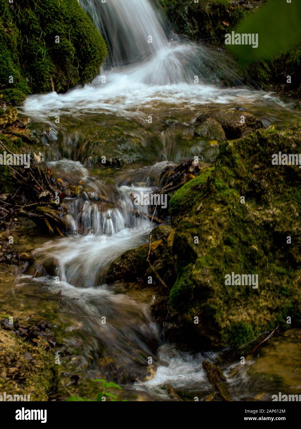 Soft waters running on rocks. Close-up of running water as a picture ...
