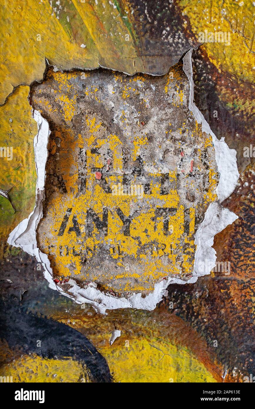 Old no parking sign revealed underneath paint Stock Photo - Alamy